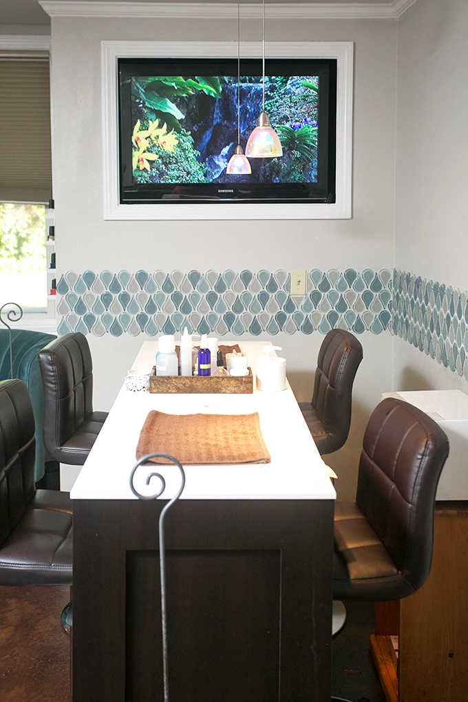 Manicure station with geometric tile work pretty enough to distract you from your cuticle situation entirely.