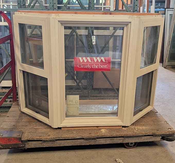 A classic bay window unit still wearing its original sticker, ready to flood someone's living room with beautiful natural light again.
