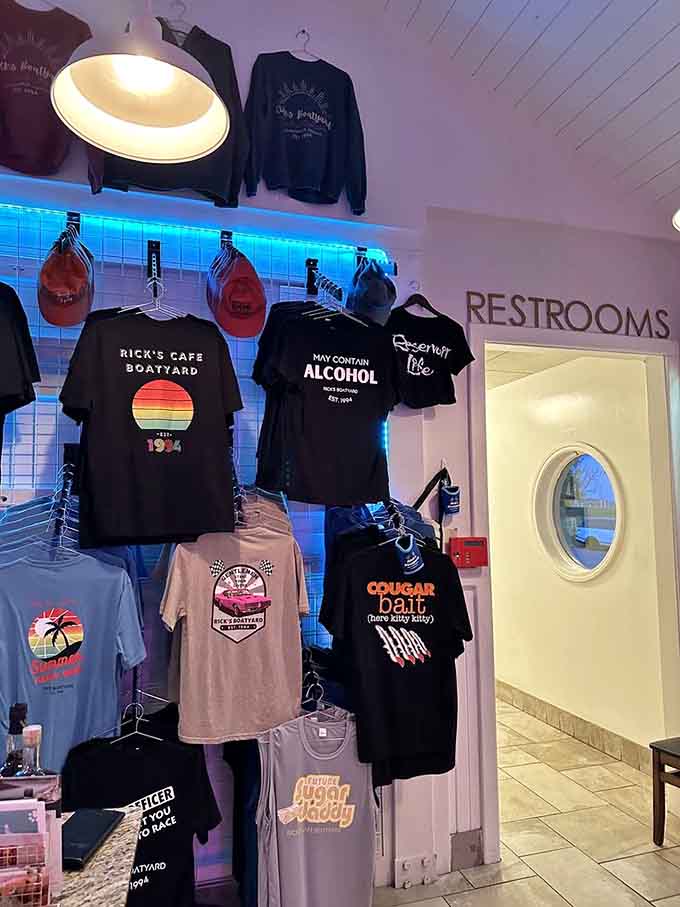 A merch wall with shirts reading "May Contain Alcohol" is honestly truth in advertising.
