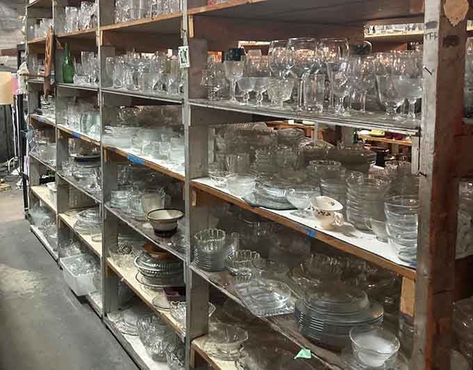 Crystal and glassware gleam on industrial shelving, ready to elevate your next dinner gathering.