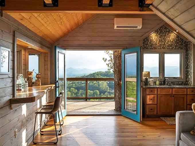 Those teal French doors swing open and suddenly the Blue Ridge Mountains are your living room wall.