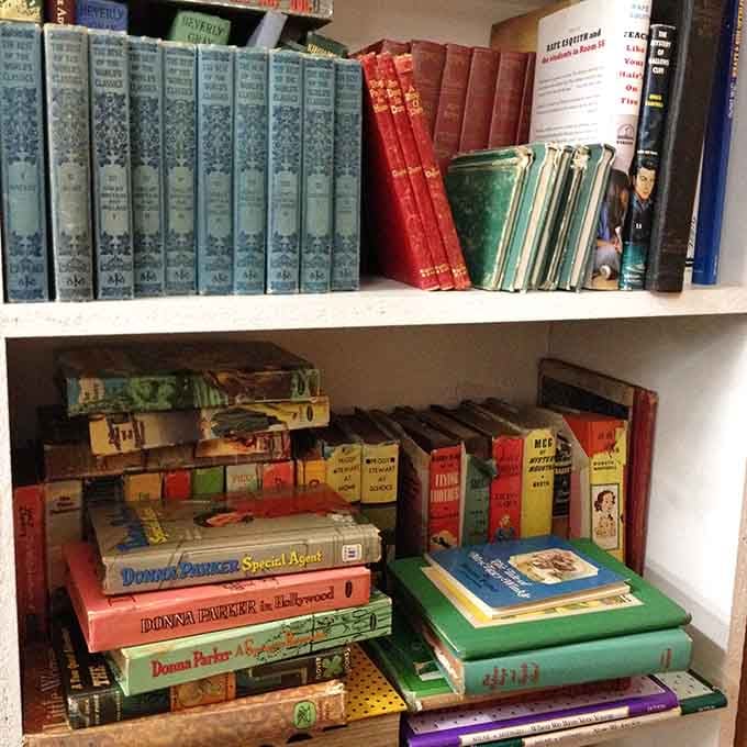 Old books stacked like literary time machines, ready to transport you back to when reading was the main entertainment option.
