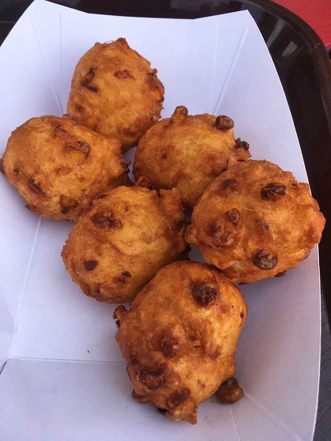 Clam fritters golden and round, the kind of starter that makes you forget you ordered an entree.