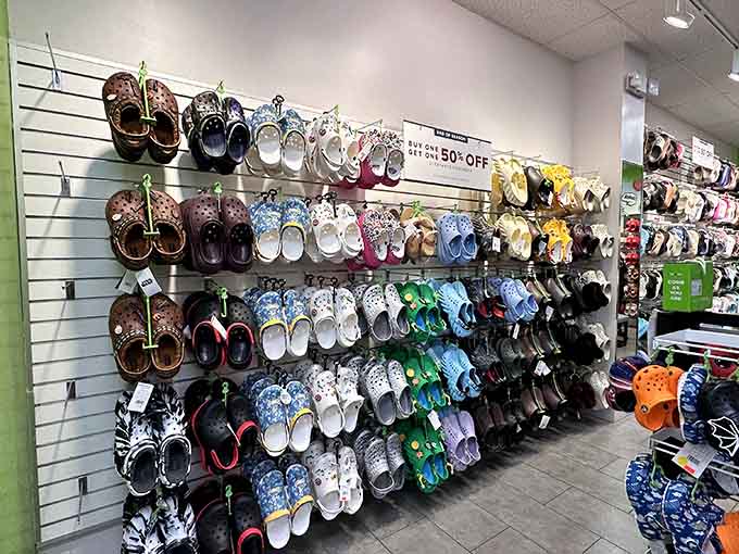An entire wall of Crocs in every pattern known to humanity. Comfort and personality, together at last.