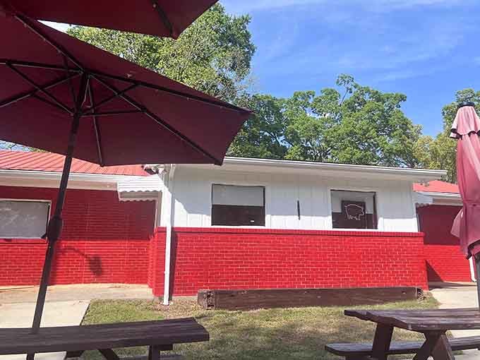 Bold red bricks and shady patio umbrellas at The Boneyard make outdoor dining feel like a genuine reward.