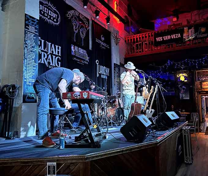Blues musicians setting up on a stage that has hosted legends, the kind of room where the music gets under your skin.