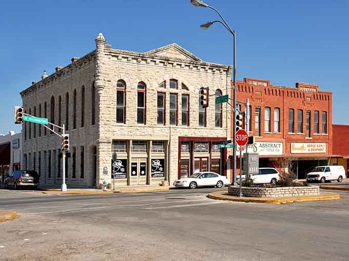That limestone corner building anchors downtown like a quiet anchor, solid, beautiful, and completely sure of itself since forever.