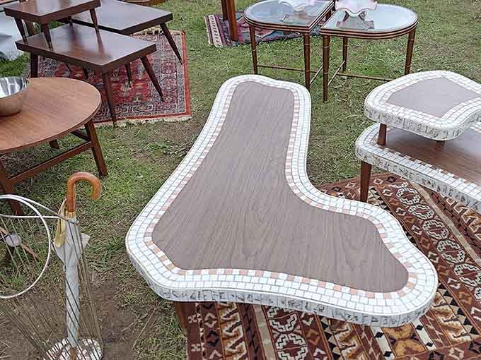 A mosaic-topped table that looks like it belongs in a design magazine, sitting casually in a field in Dutchess County.