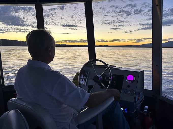 Steady hands on the wheel, a sky full of color. The captain has seen this before and still loves it.