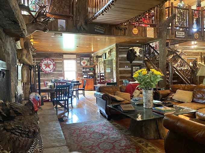 Leather couches, sunflowers, a vintage Texaco sign, and a mounted turkey. This lounge area is part living room, part folk art gallery.