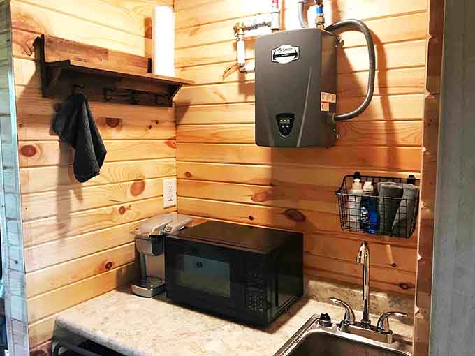 A Keurig, a microwave, and a tankless water heater. The treehouse is more prepared than most of us.