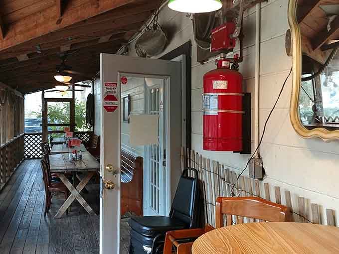 A porch with mismatched chairs and real character. This is where good meals and easy conversation happen naturally.