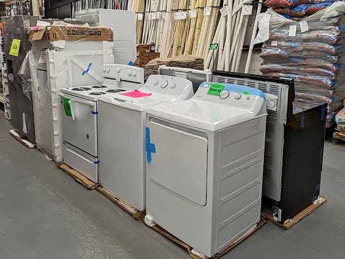 Stoves, washers, and dryers lined up on the floor. Yes, you can buy a major appliance at a Texas beach store.