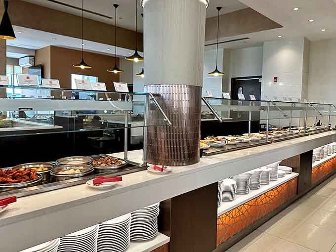 Gleaming buffet stations stretching into the distance, stacked with dishes that demand at least two return trips.