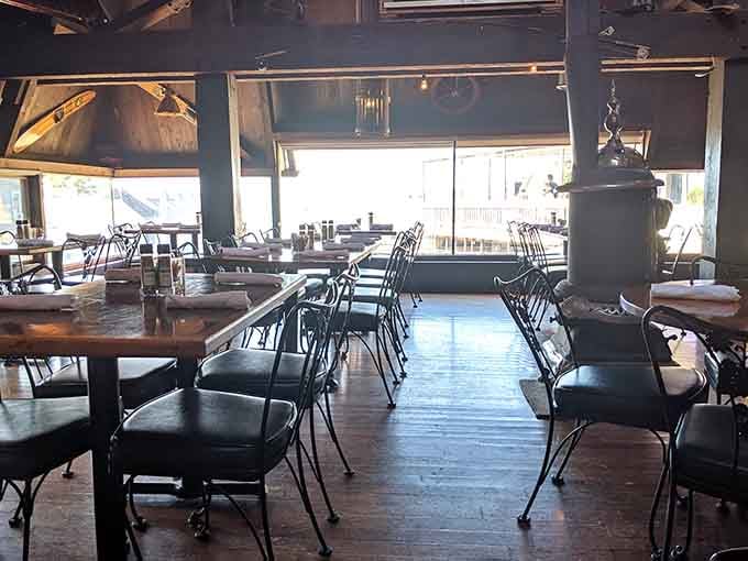 That vintage wood stove anchoring the dining room adds rustic warmth even when it's not lit.