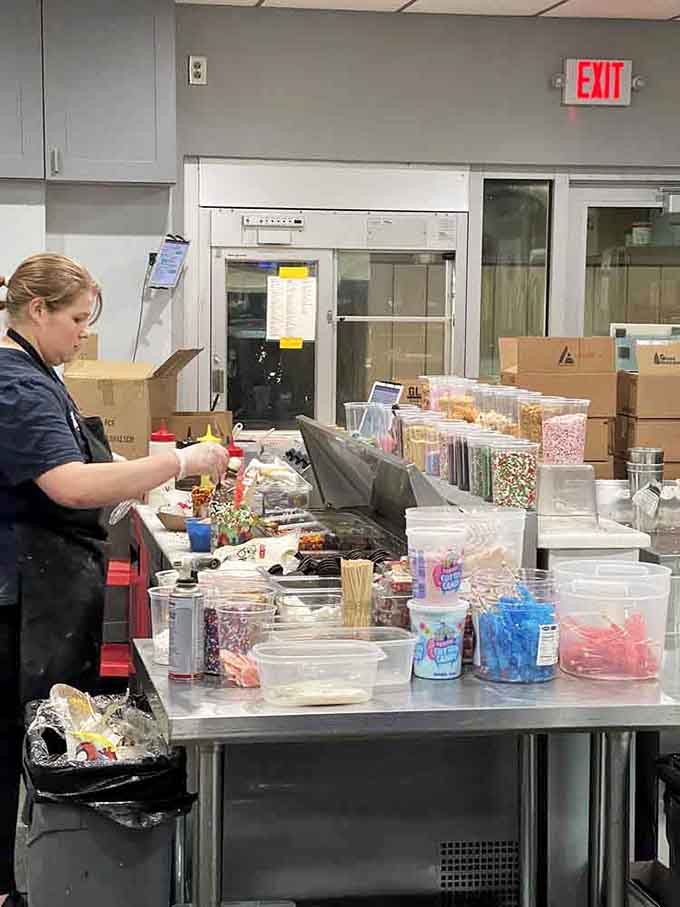 Behind the scenes, containers of toppings stretch as far as the eye can see. This is serious business.