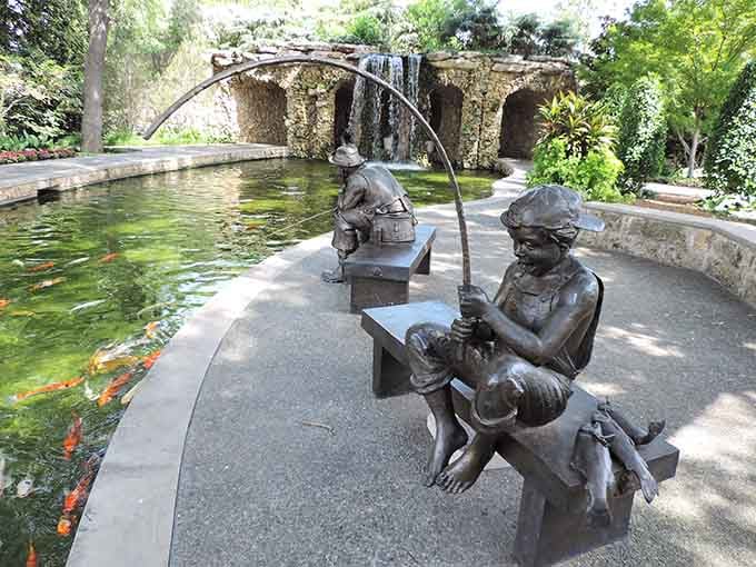 Bronze boys fishing beside a koi pond, a scene so charming it makes you nostalgic for summers past.