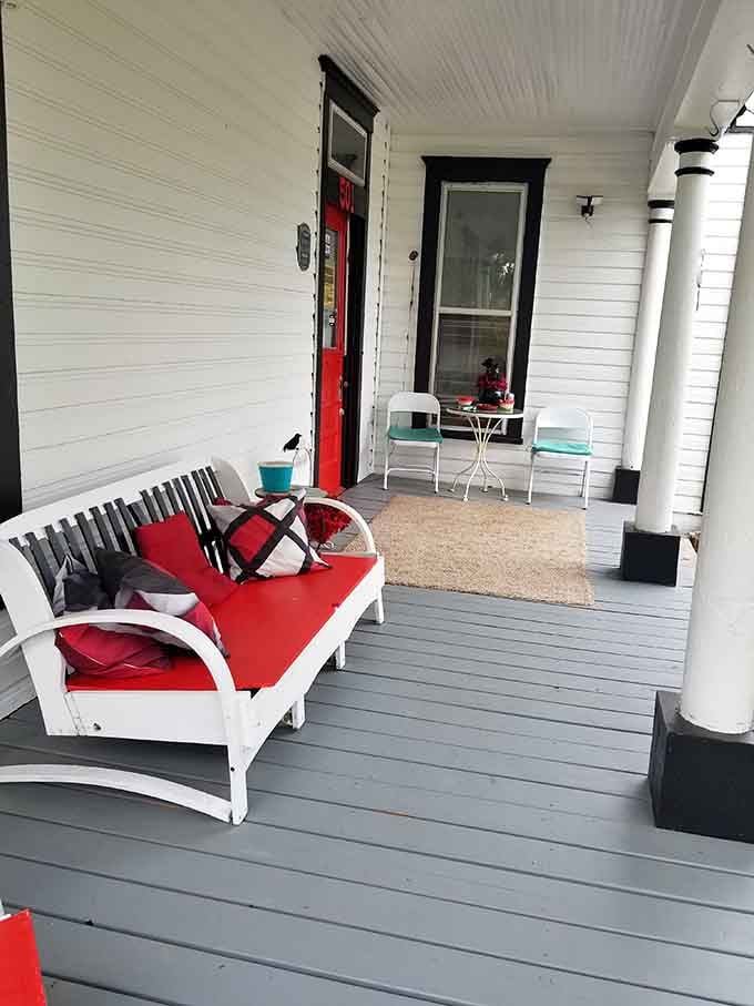 A welcoming porch that says "come on in," while the house itself whispers "are you absolutely certain?"