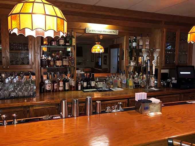 Warm wood, stained glass pendant lamps, and a fully stocked bar, Green Manor proves Southern hospitality comes in many delightful forms.