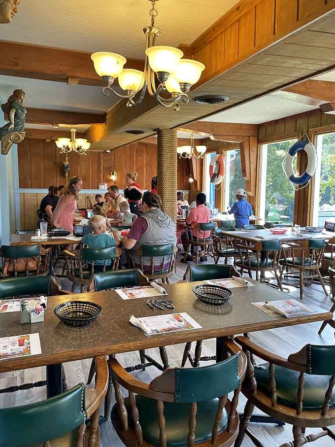 Families gather under nautical decor, united by the universal language of unlimited seafood and shared joy.