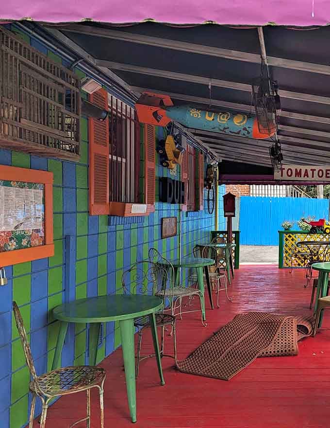 Striped blue and green walls, a red painted floor, and outdoor seating that makes even waiting for a table feel like part of the fun.