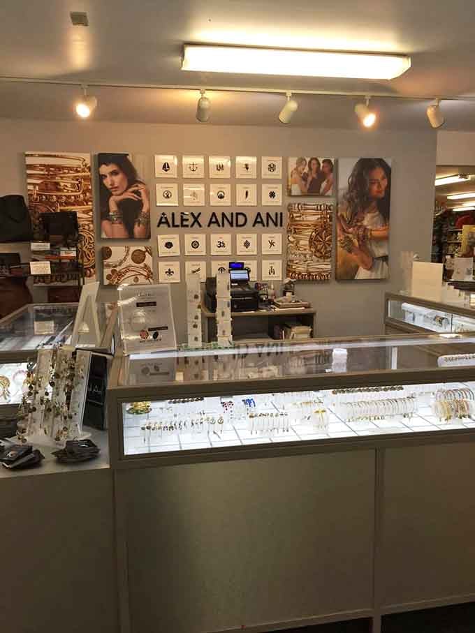 The jewelry section features Alex and Ani alongside other brands, turning a candle shop visit into a full-blown accessory shopping spree.