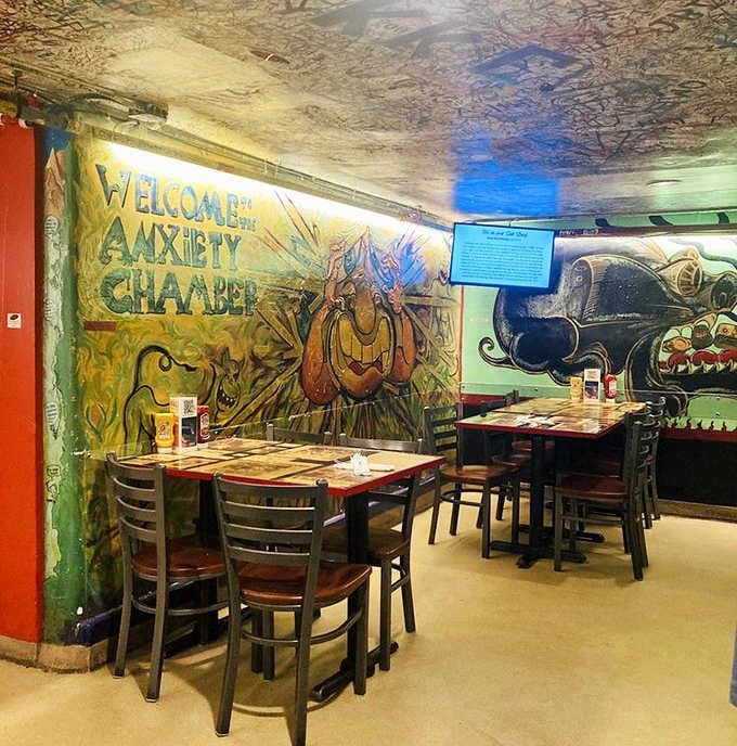 The Anxiety Chamber mural greets you with wild creatures and bold color. Dinner and a show, all at once.
