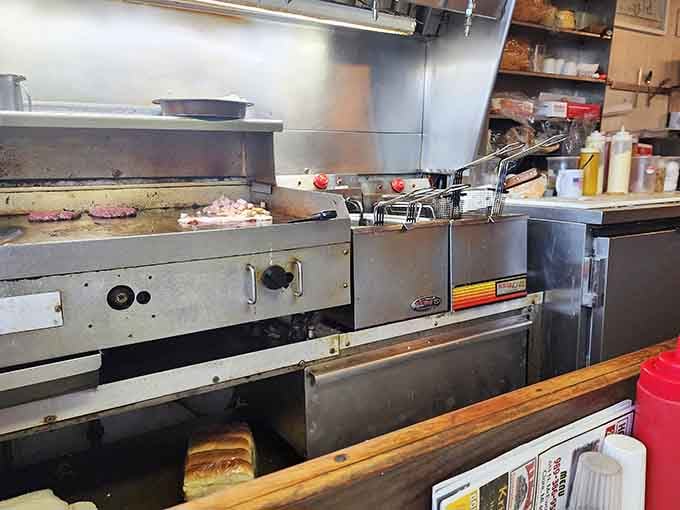 Burgers sizzling on a flat-top grill, the kind of sight and sound that makes your stomach speak up immediately.