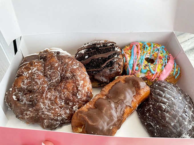 Six donuts in a box, each one a different personality, proof that variety really is the spice of breakfast.