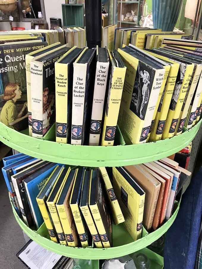 Nancy Drew mysteries lined up in their distinctive yellow spines, ready to solve another case.