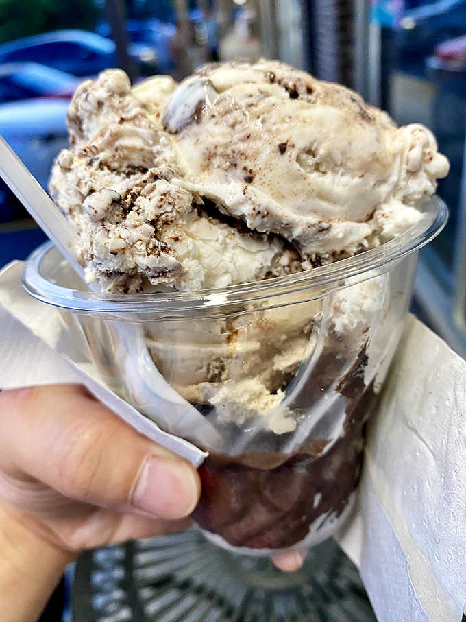 Scoops of ice cream layered with fudge and topped generously. The kind of sundae that makes you forget what you were worried about.