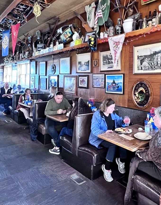 Diners enjoying their meals surrounded by decades of memorabilia, because good food tastes better with great atmosphere.