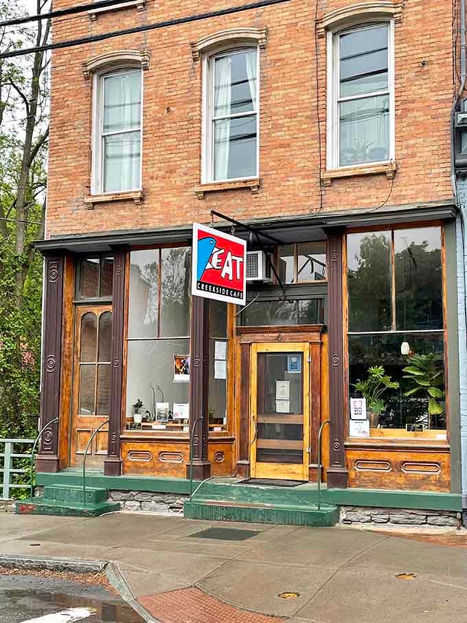 That bold EAT sign hanging outside Creekside Cafe isn't a suggestion, it's a direct and very reasonable instruction you should follow immediately.