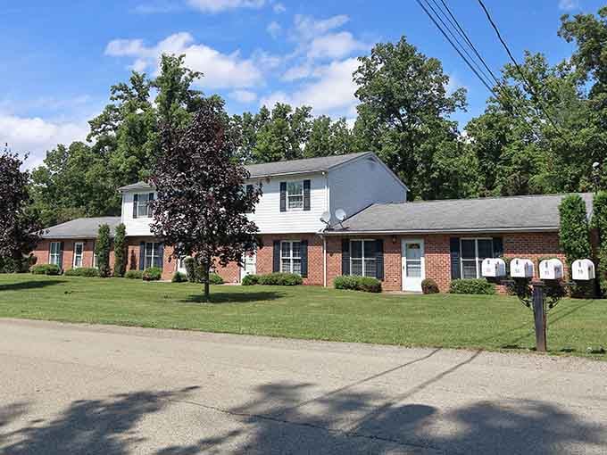 Brick apartments with manicured lawns and actual mailboxes, the kind of neighborhood where people still know their neighbors.