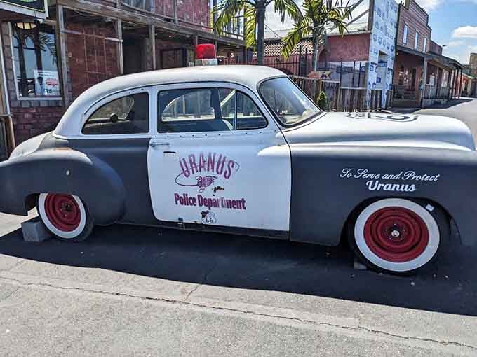 "To Serve and Protect Uranus," reads the vintage police cruiser, and it delivers on that promise daily.