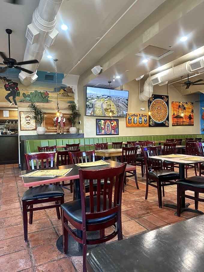 Colorful murals, terracotta floors, and green booths: the kind of dining room that feels like it has stories to tell.
