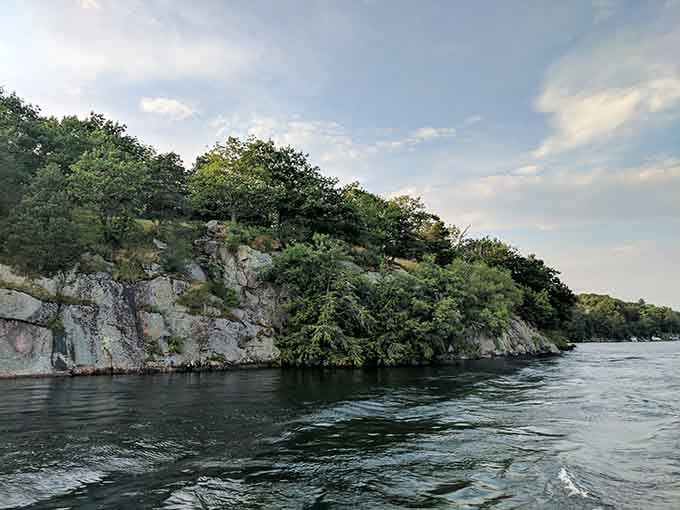 Rocky cliffs standing guard like nature's own security system, keeping the chaos of civilization at bay.
