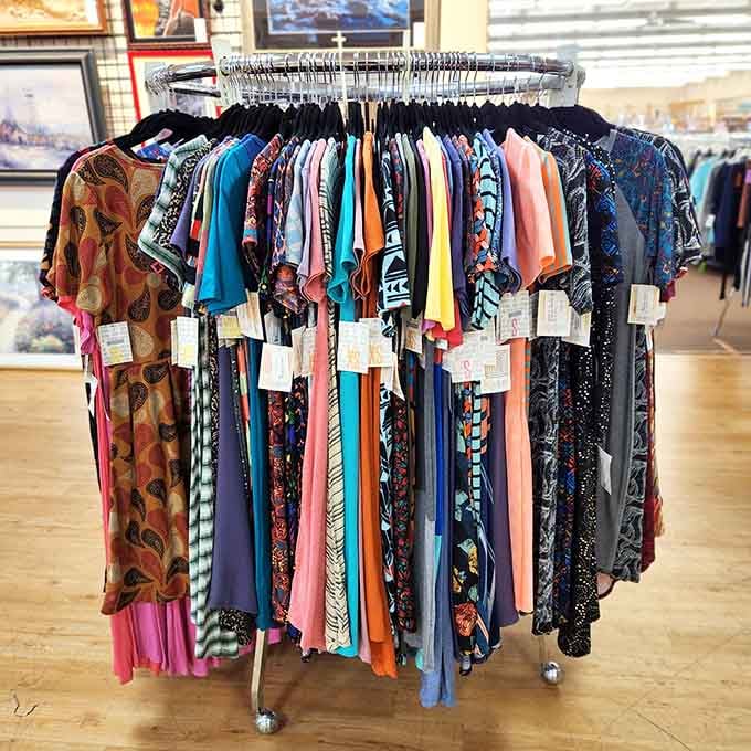 Colorful dresses hang like a fashion rainbow, each one representing someone's fresh start wardrobe.