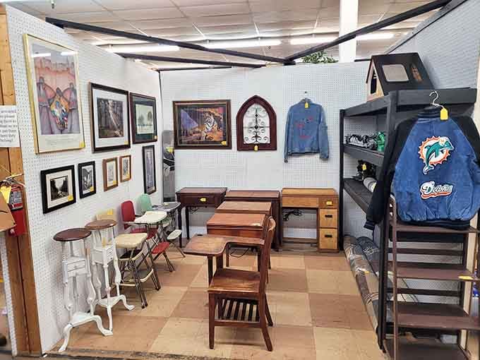 Framed artwork, vintage desks, and a Miami Dolphins jacket sharing one booth, because variety is the whole point here.