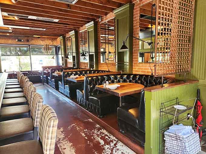 Tufted leather booths, warm wood tables, exposed brick walls. Windsor's seating area feels like your favorite living room, upgraded.