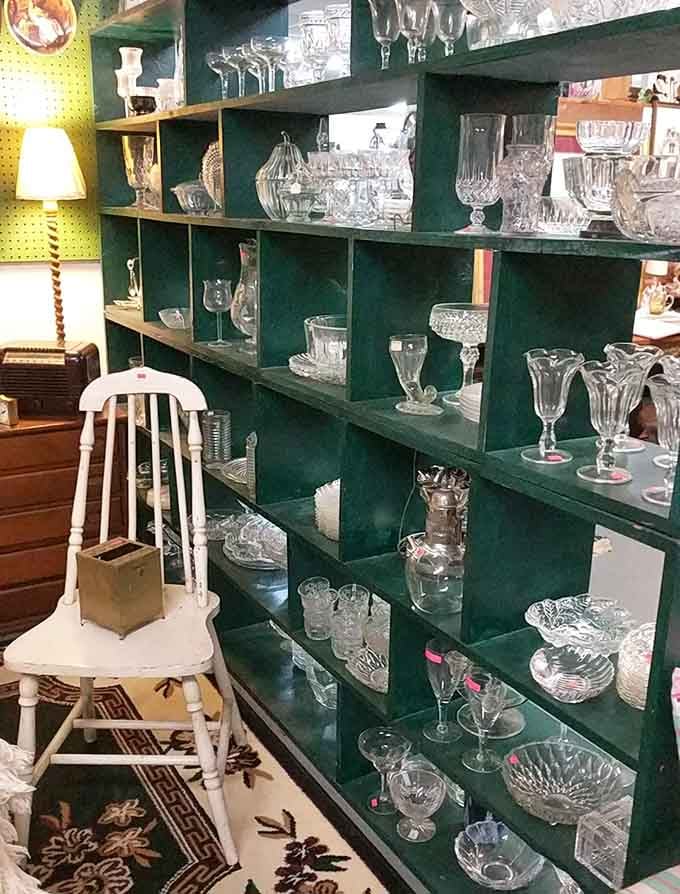 Floor-to-ceiling shelves of crystal glassware catching the light, like a chandelier that you can actually take home.