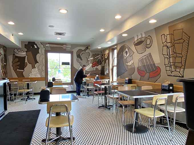 Whimsical wall art and cozy seating make this the kind of spot you'll want to linger.