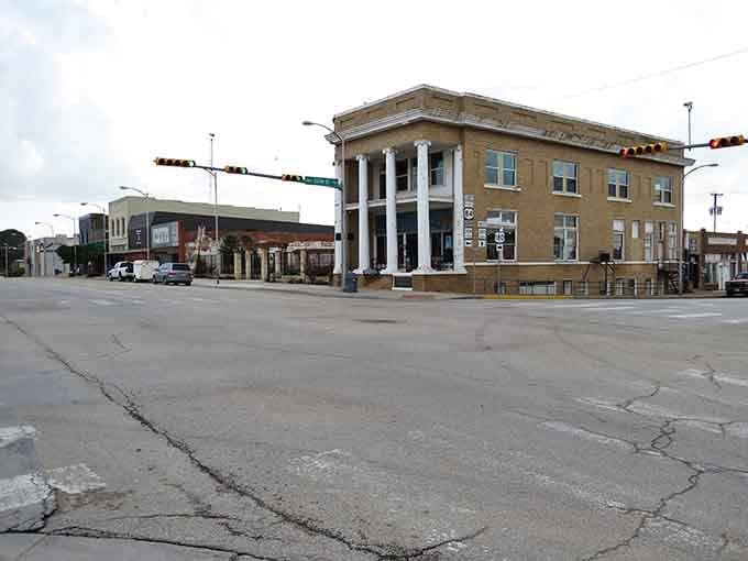 That columned corner building in Snyder stands at attention like it's guarding the whole intersection single-handedly.