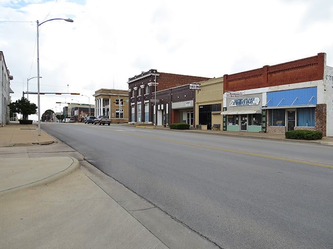 Snyder 's downtown block tells a layered story, with brick facades and blue storefronts holding their ground side by side.