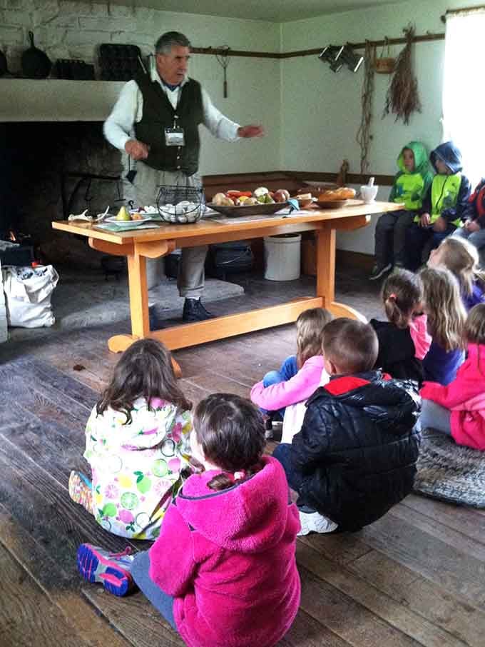 Wide-eyed kids seated on old wooden floors prove that great storytelling makes history feel brand new every single time.