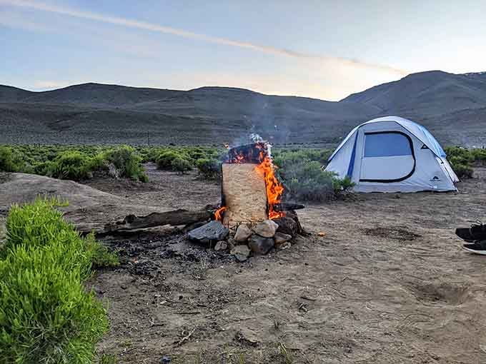A campfire, a tent, and a sky that's about to put on the greatest star show you've ever witnessed.
