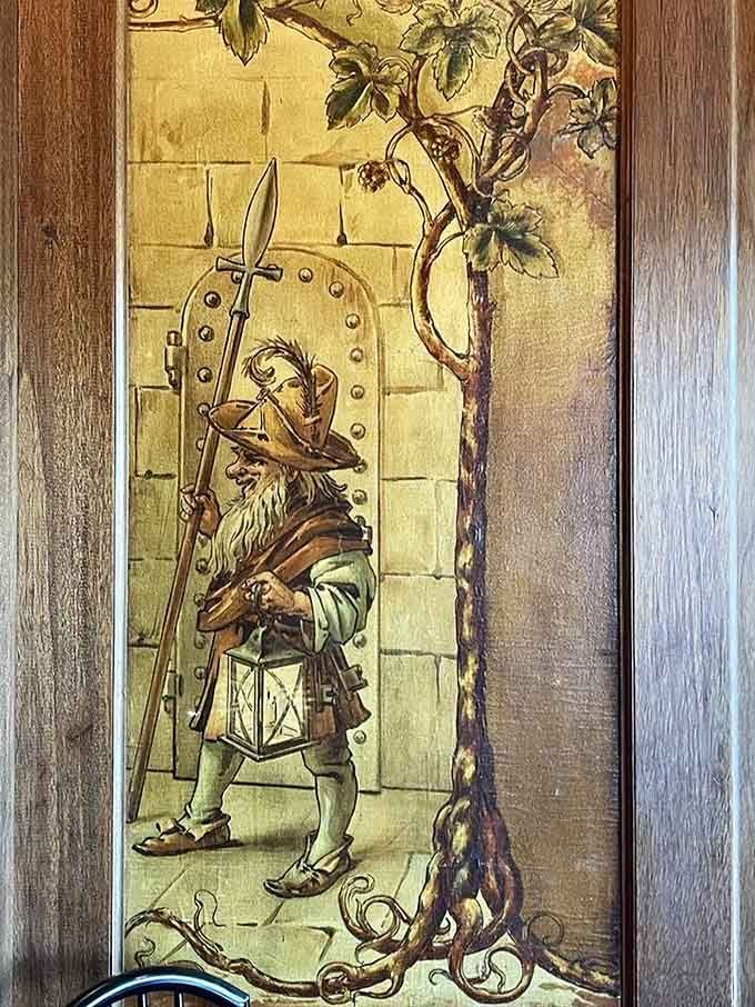 Whimsical wall art featuring a medieval character, because every great restaurant needs a little unexpected charm.