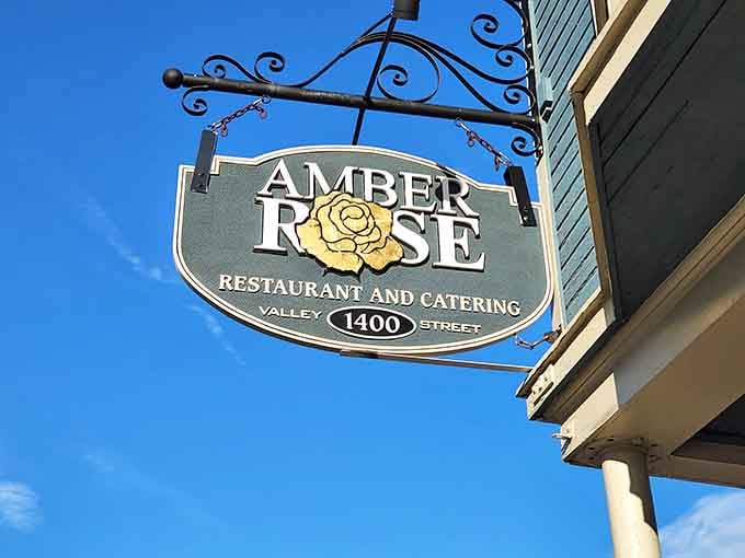 That ornate hanging sign against a blue Ohio sky is practically an invitation you'd be foolish to ignore.