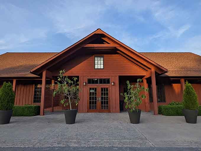 The main building stands proud like a modern barn that went to design school and came back sophisticated.