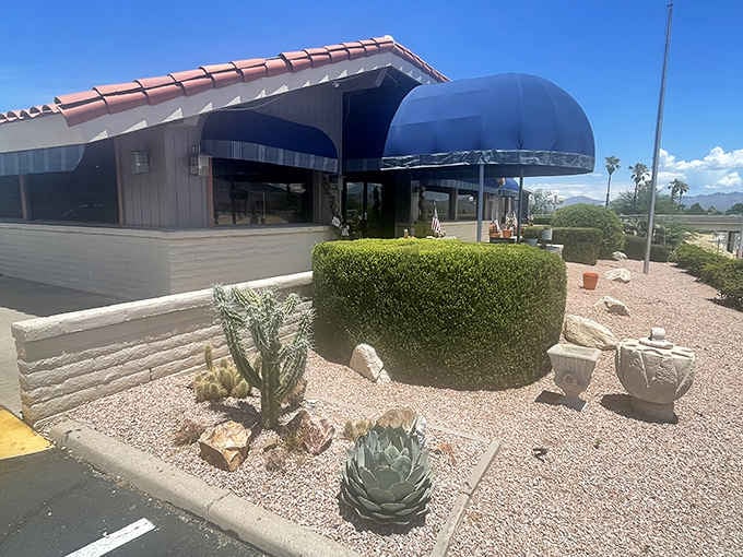 Desert landscaping frames the entrance beautifully. Even the cacti seem happy to welcome you here.